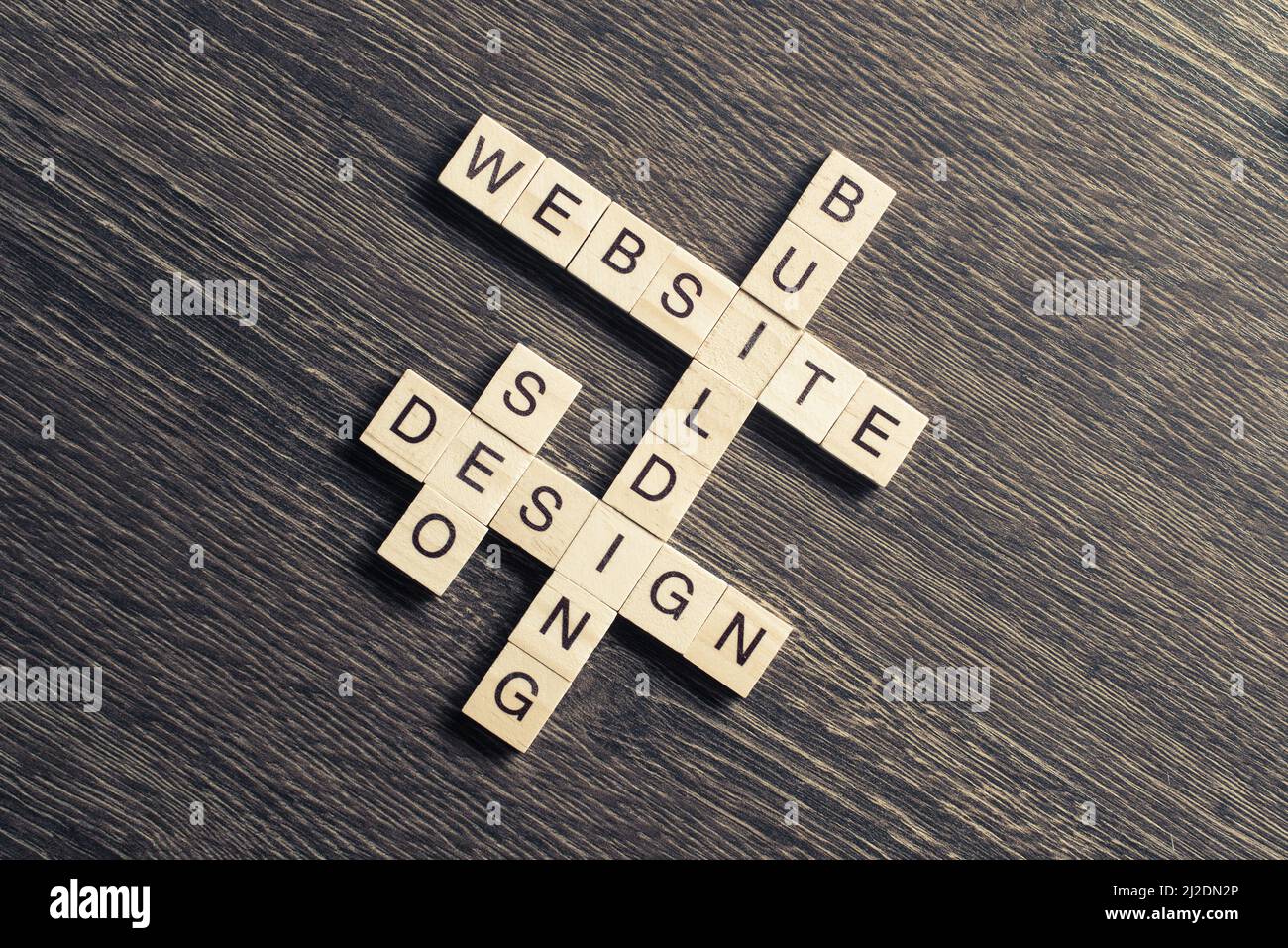 Conceptual media keywords on table with elements of game making ...