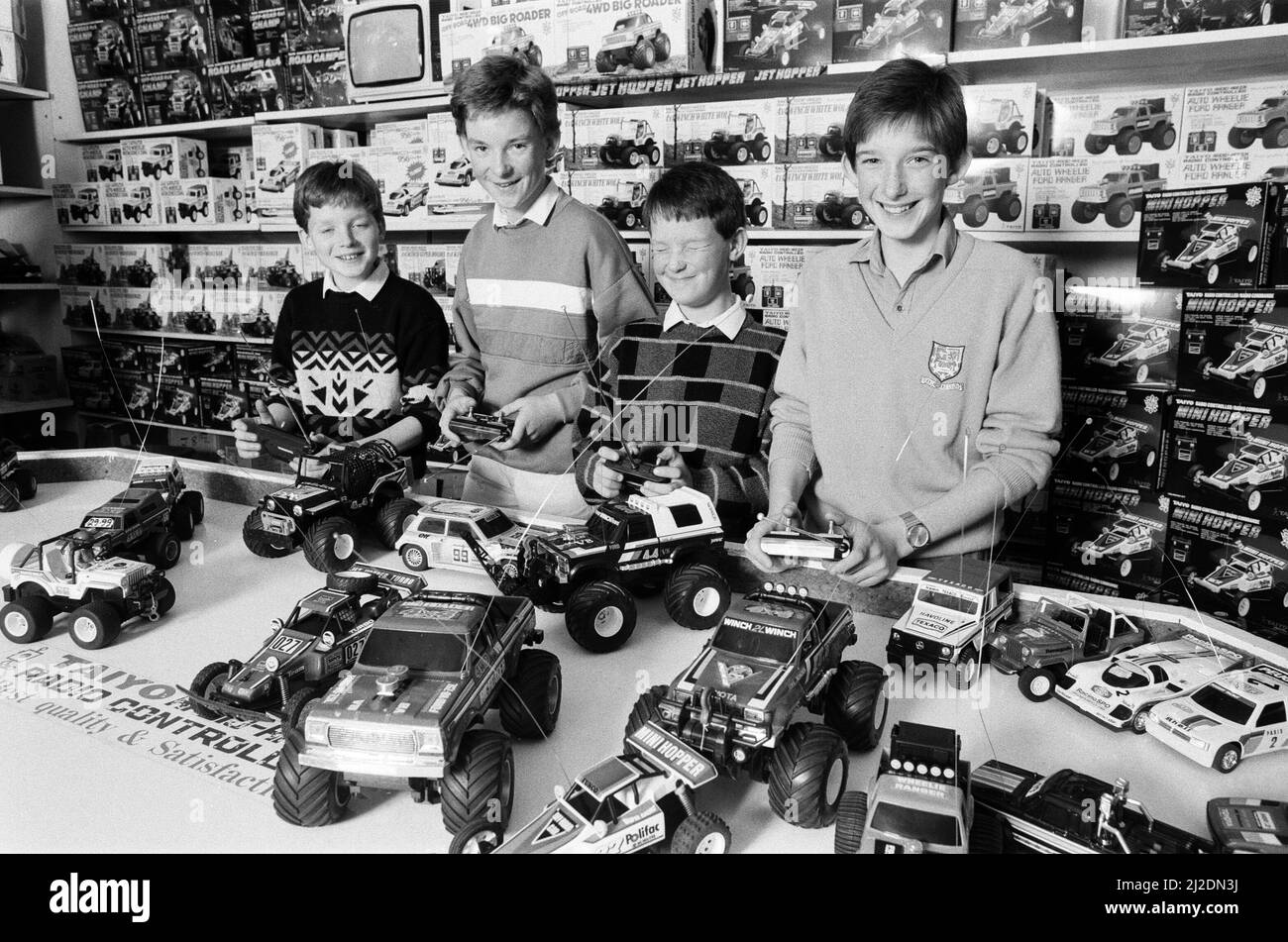 Young boys playing with toy remote control cars in Hamley's, London ...
