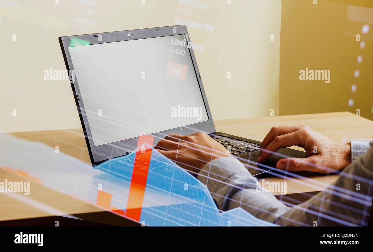 Close up shot of a man working on computer with blended image of an ...