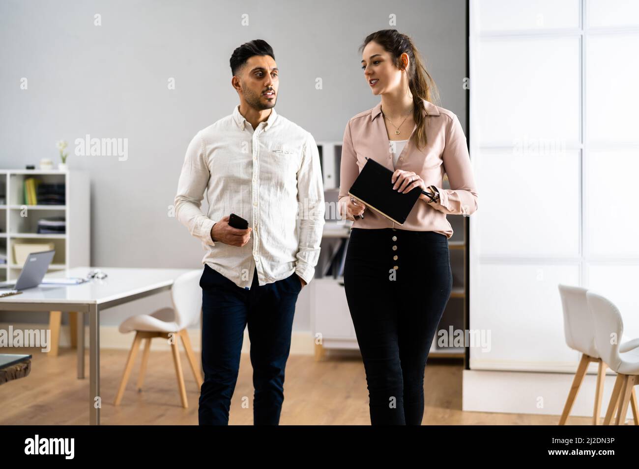 Two Business People Talking. Teamwork And Planning Stock Photo - Alamy Two Business People Talking. Teamwork And Planning Stock Photo - Alamy