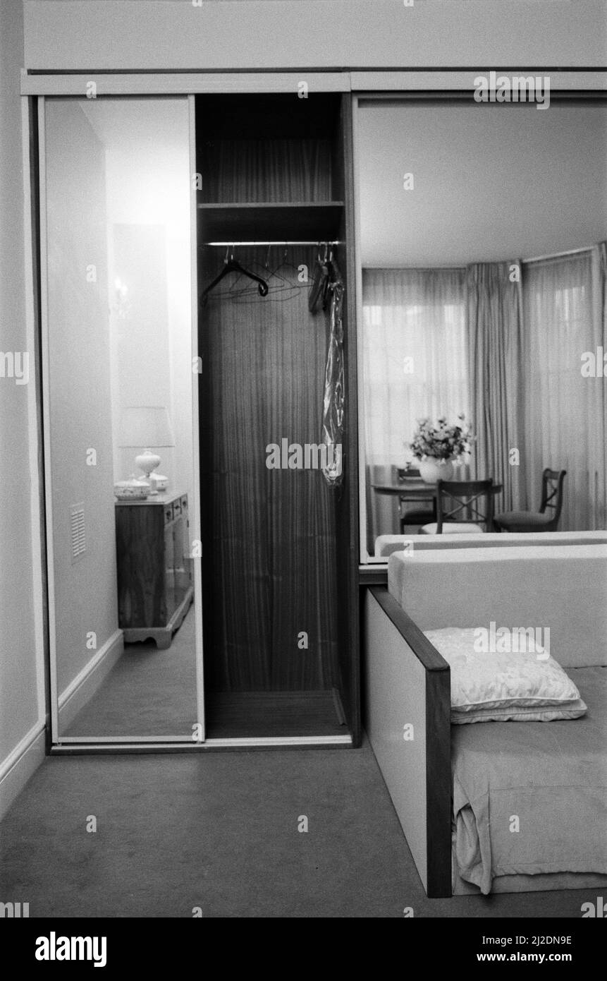 Interior view of a flat, showing the living room area, mirrored ...
