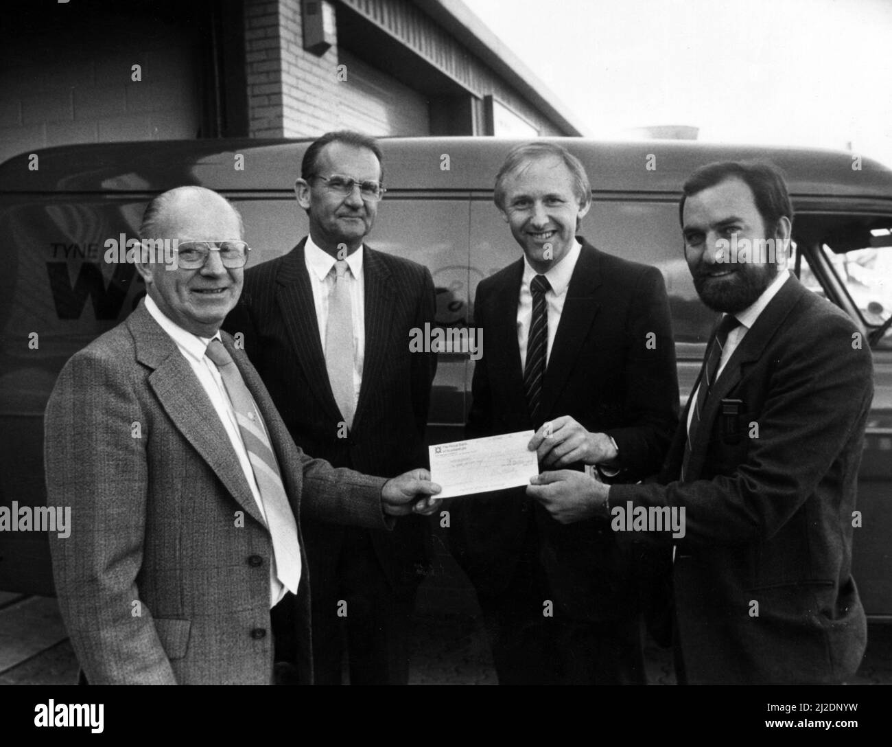 Presenting a cheque hi-res stock photography and images - Alamy