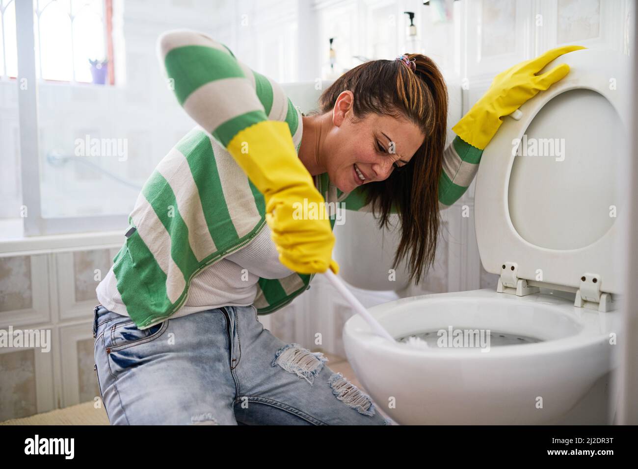 Person cleaning the toilet hi-res stock photography and images - Alamy