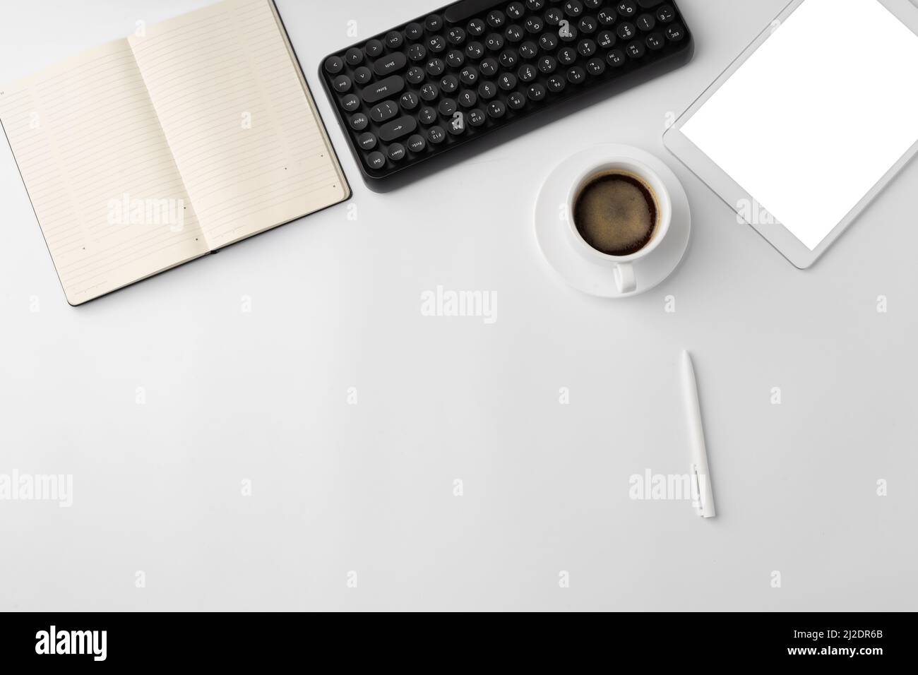 Minimalistic white workplace with keyboard and notebook Stock Photo - Alamy