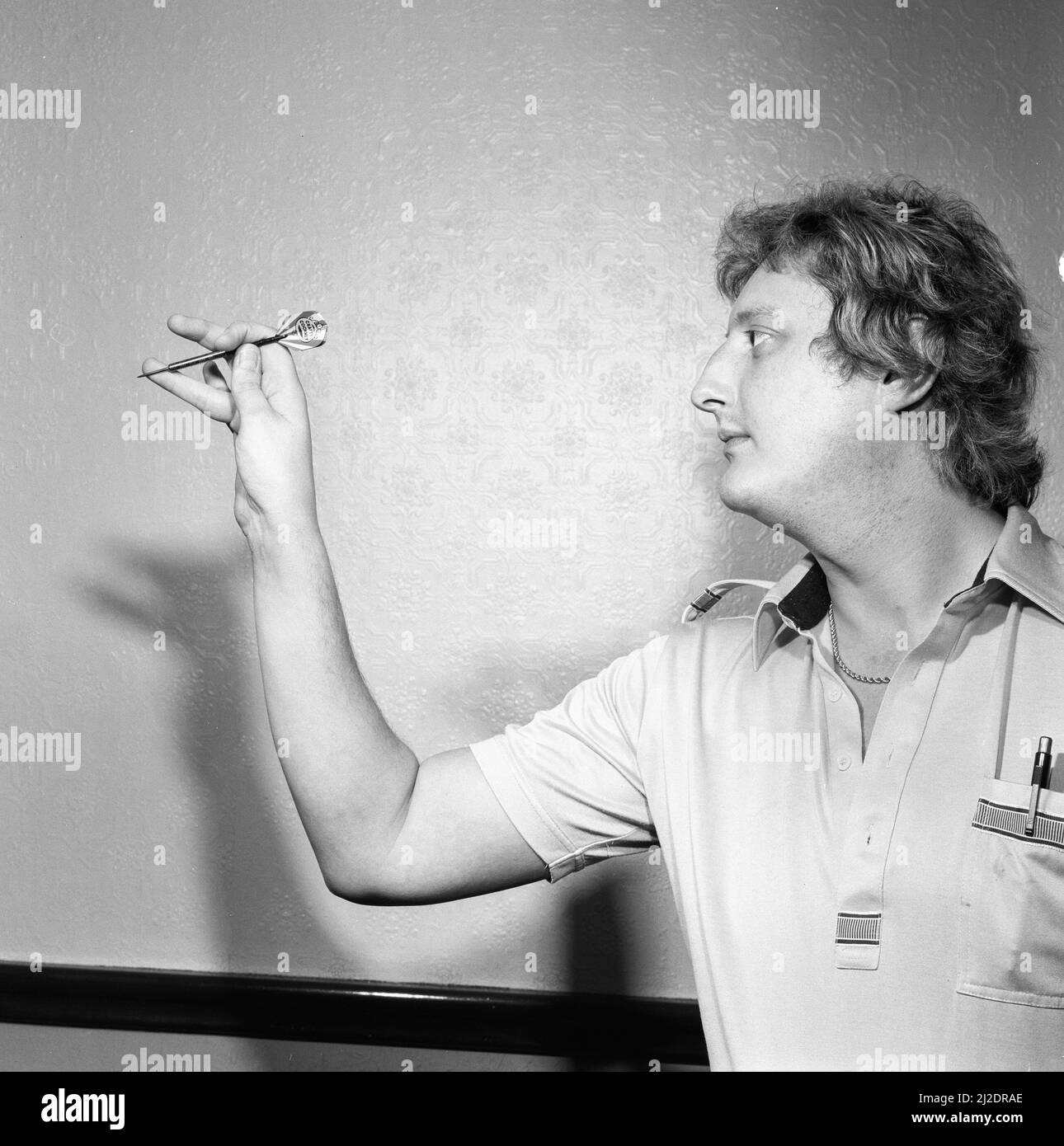 Close up feature on British darts player Eric Bristow in dart throwing ...