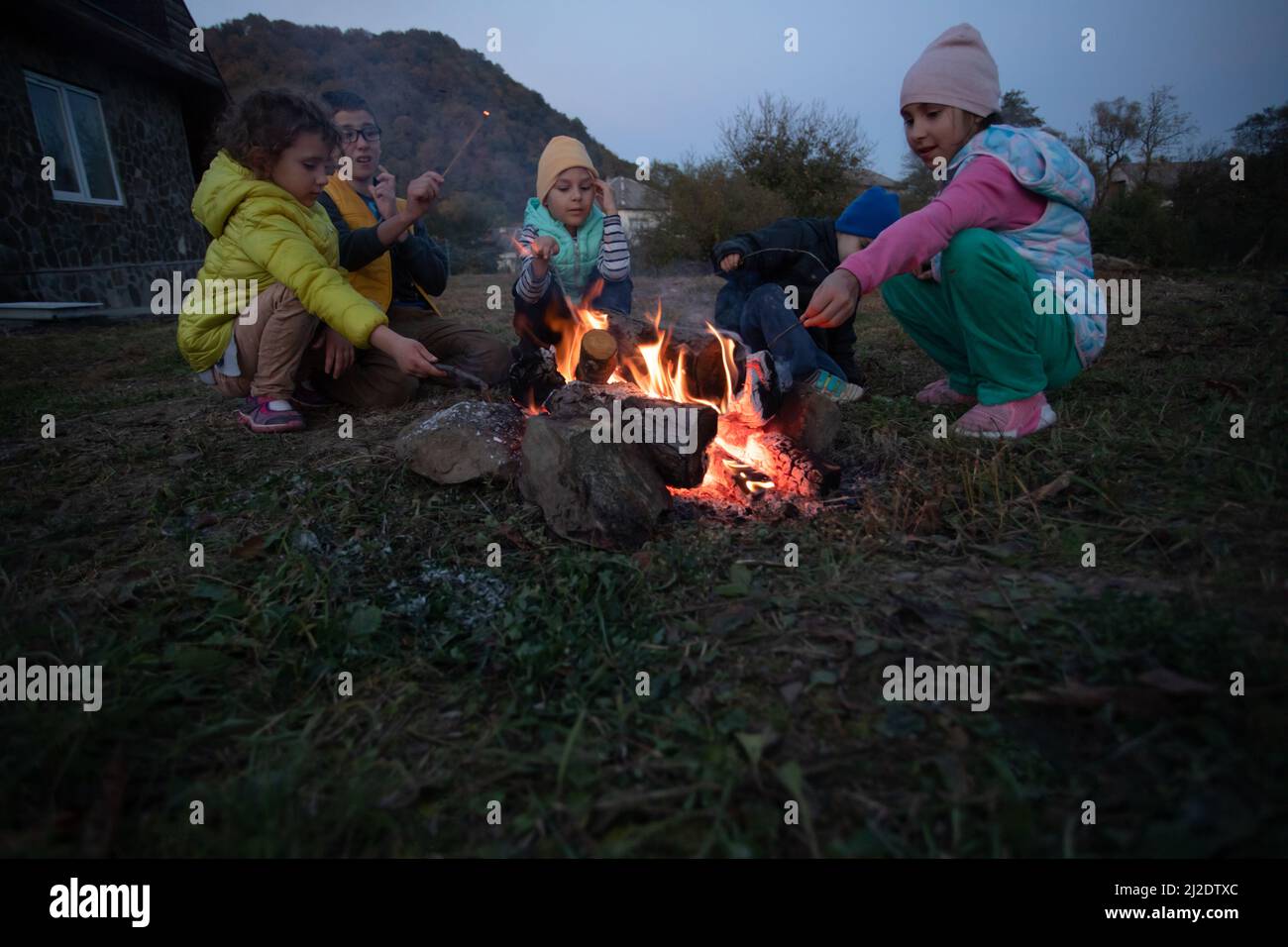 Children in the camp by the fire Stock Photo - Alamy