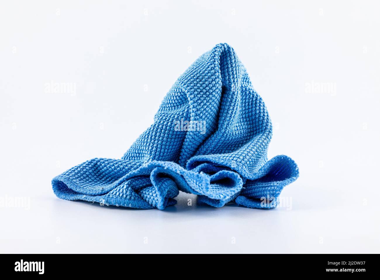 Blue microfiber fabric with rough texture for cleaning dust isolated on ...