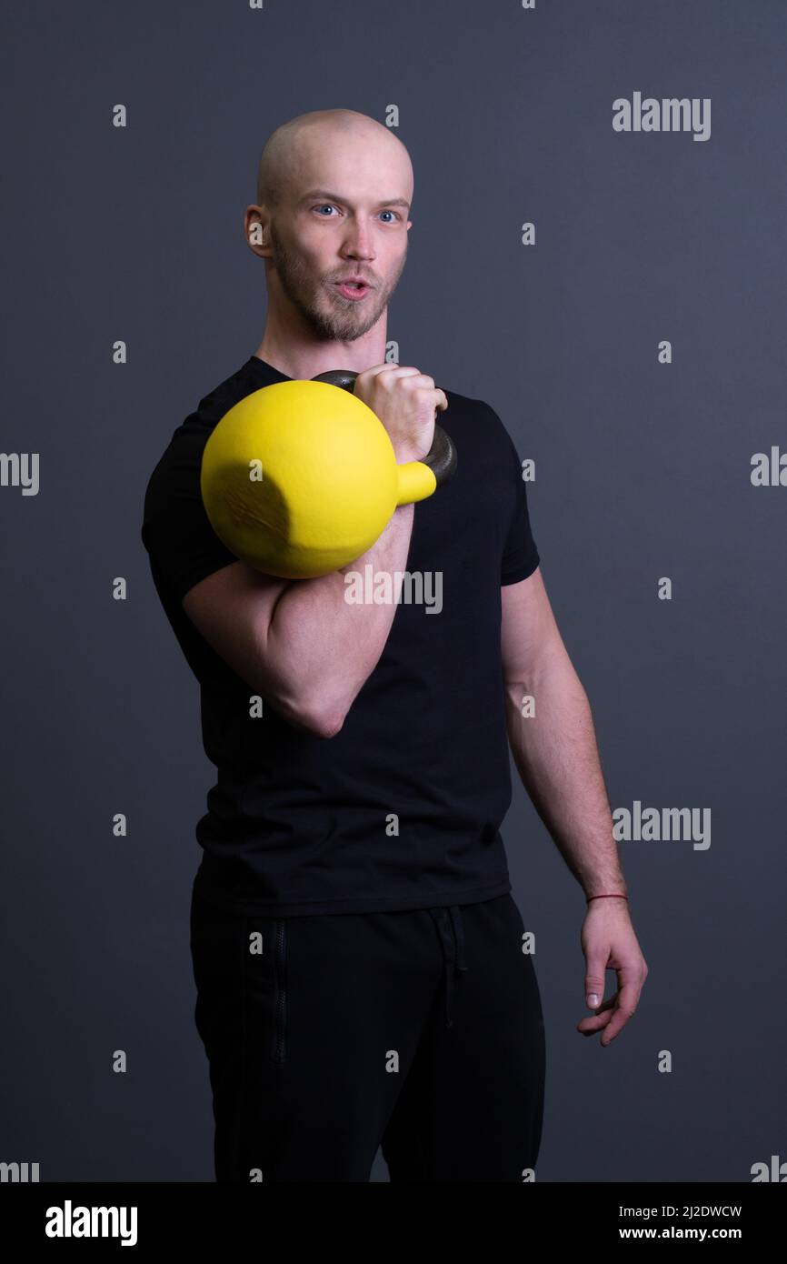 Guy with a yellow kettlebell gym anonymous workout man, from sporty ...