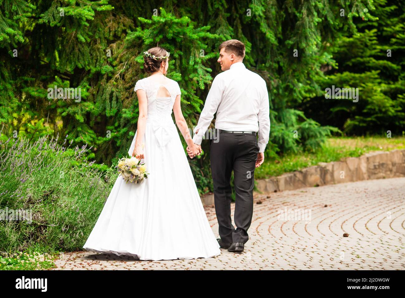 Happy bride and groom after wedding ceremony Stock Photo - Alamy