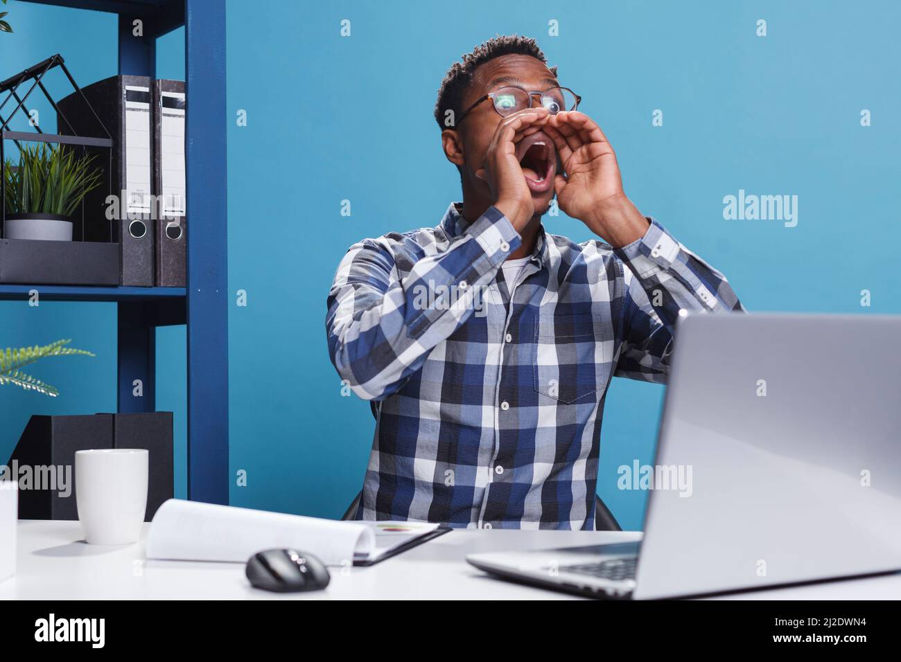 Marketing department young adult team leader shouting loud at employees ...