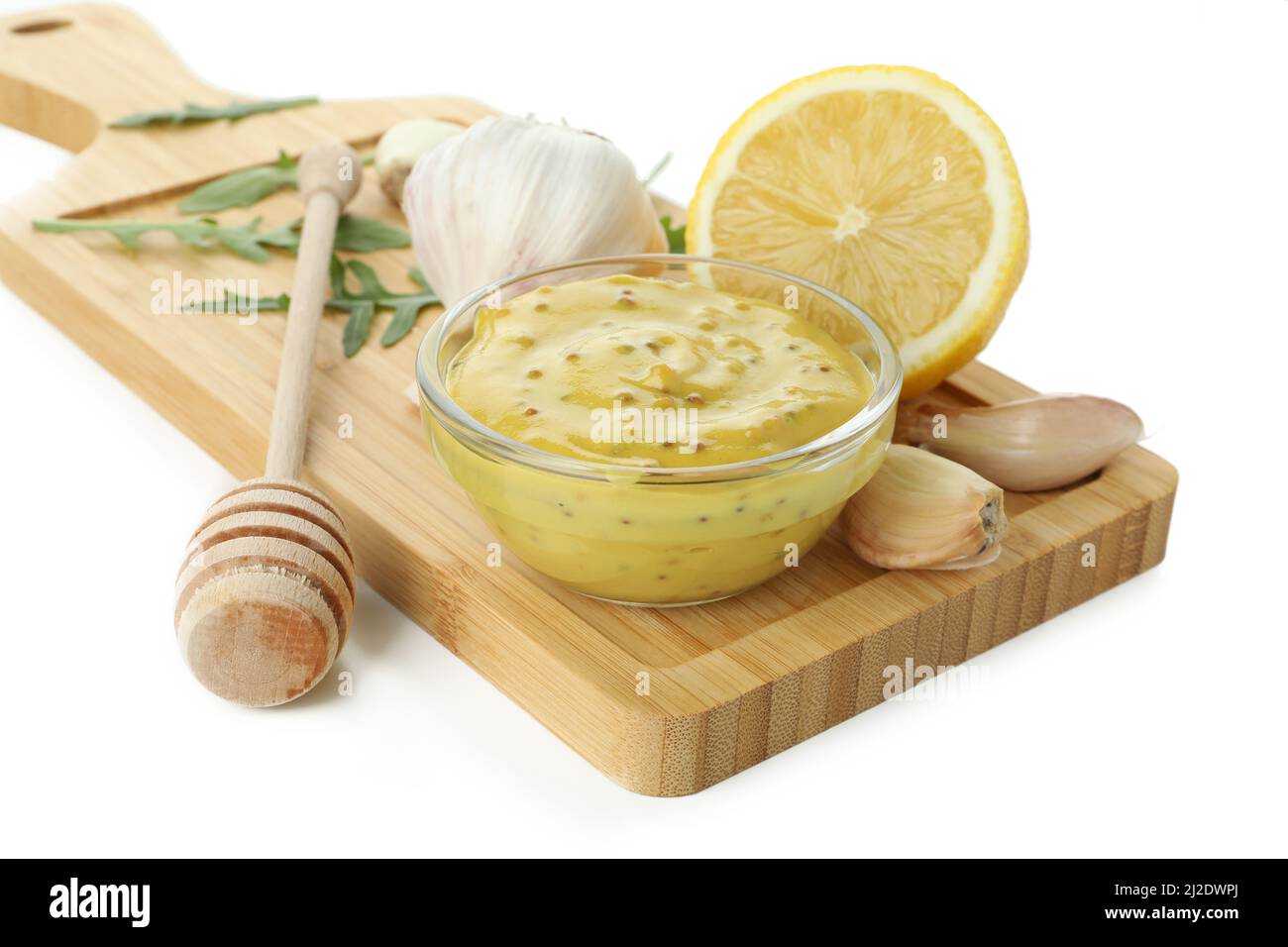 Composition of cooking mustard honey sauce isolated on white background ...