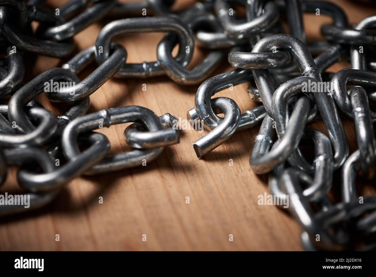 Chains are only as strong as their weakest links. Shot of metal chains ...