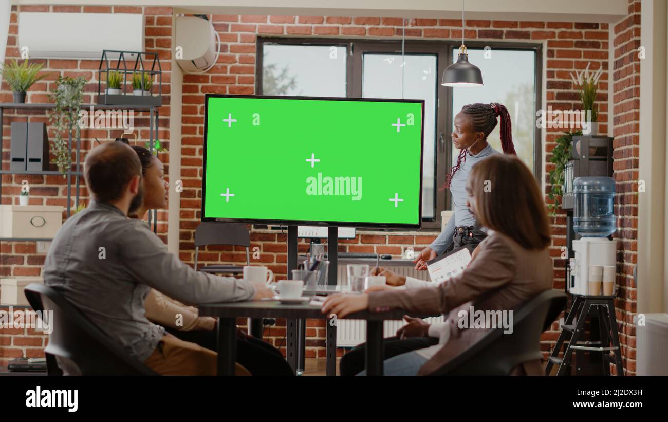 Business people doing presentation with green screen on monitor, using ...