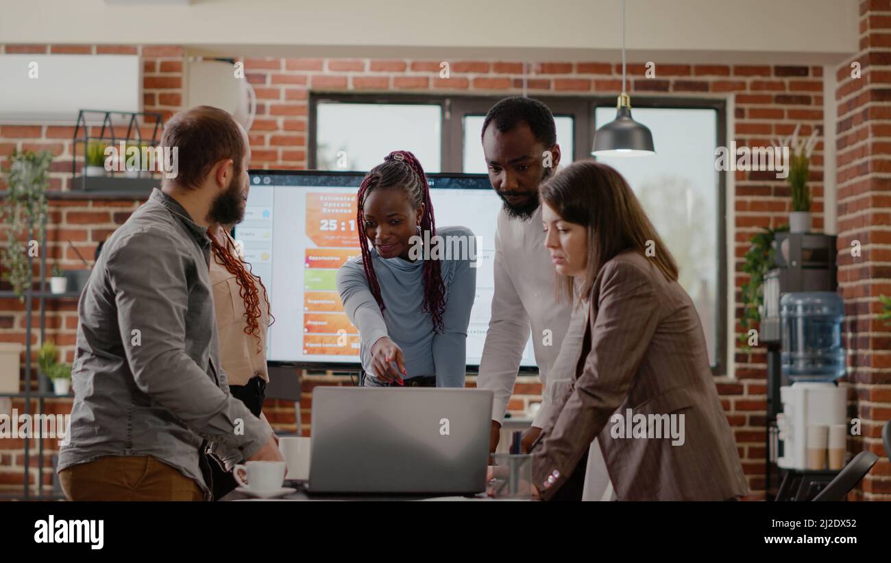 Business people joining hands in unity after big project win ...