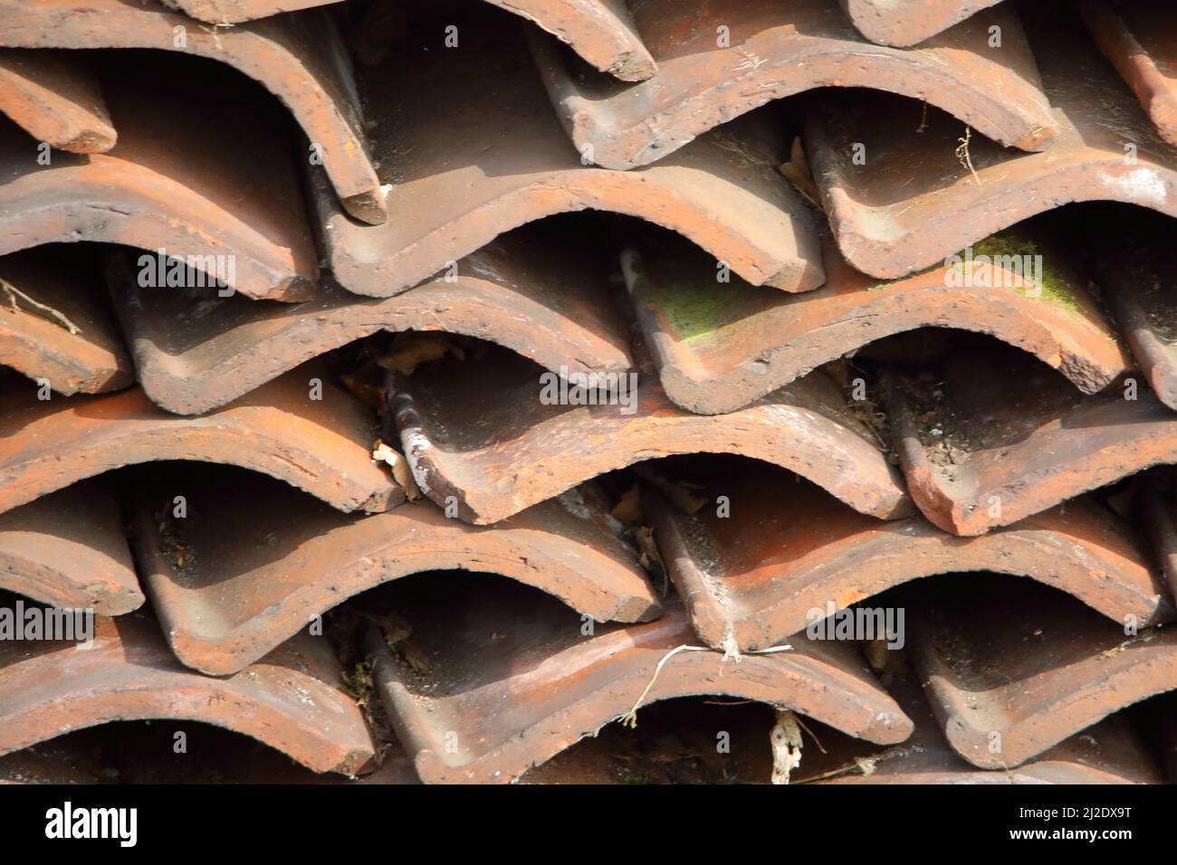 a pile of single pantiles terracotta in colour Stock Photo - Alamy