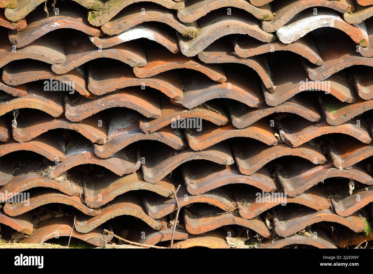 a pile of single pantiles terracotta in colour Stock Photo - Alamy