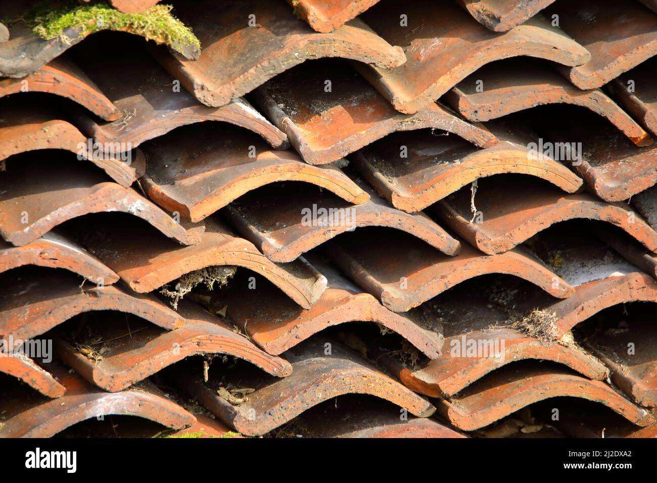 a pile of single pantiles terracotta in colour Stock Photo - Alamy