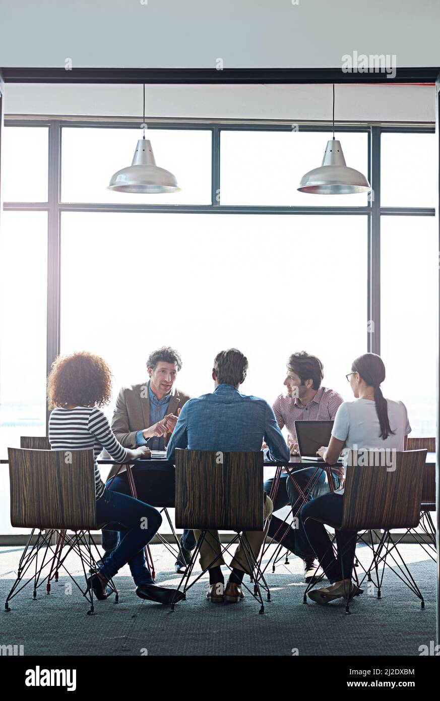 The round table of great ideas. Shot of a group of coworkers having a ...