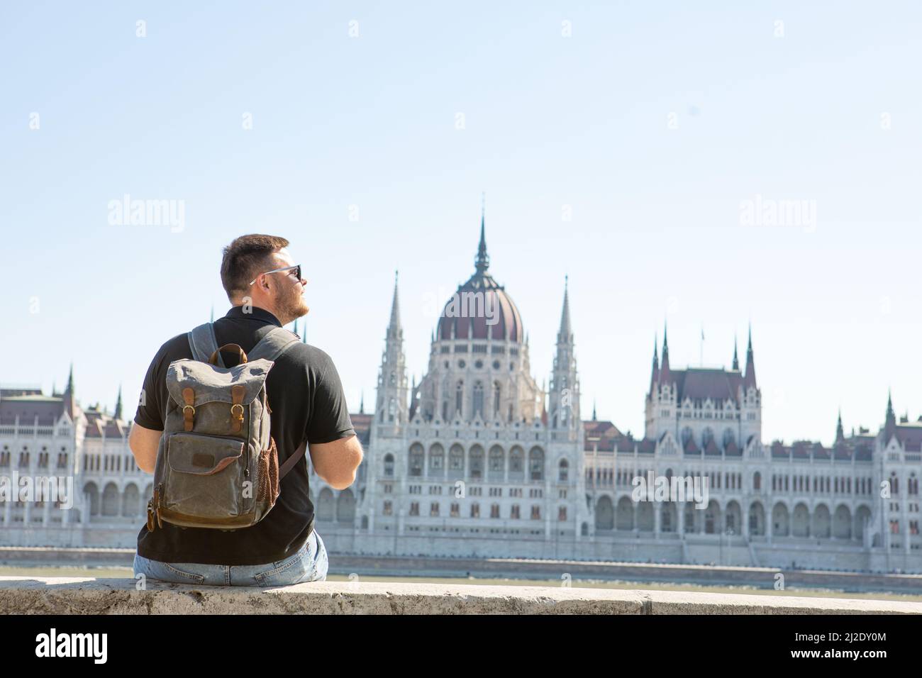 man traveler in front of Budapest parliament building copy space Stock ...