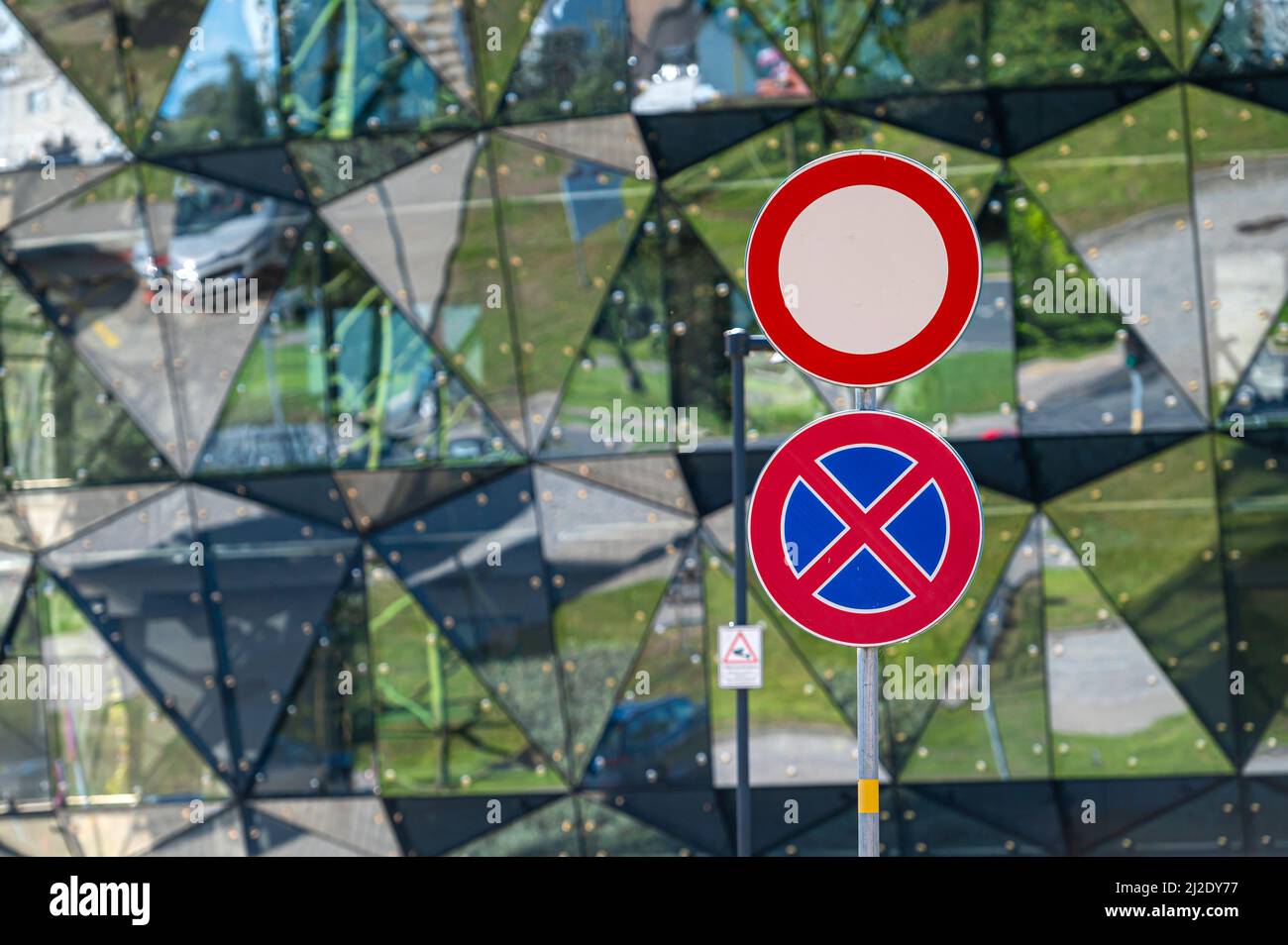 the road signs on the defocused urban background, traffic signs at city ...