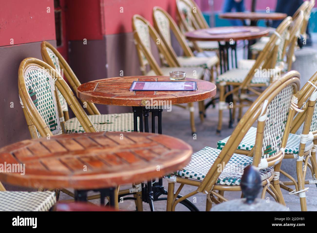 Traditional empty chairs and tables outdoors at a restaurant in the ...