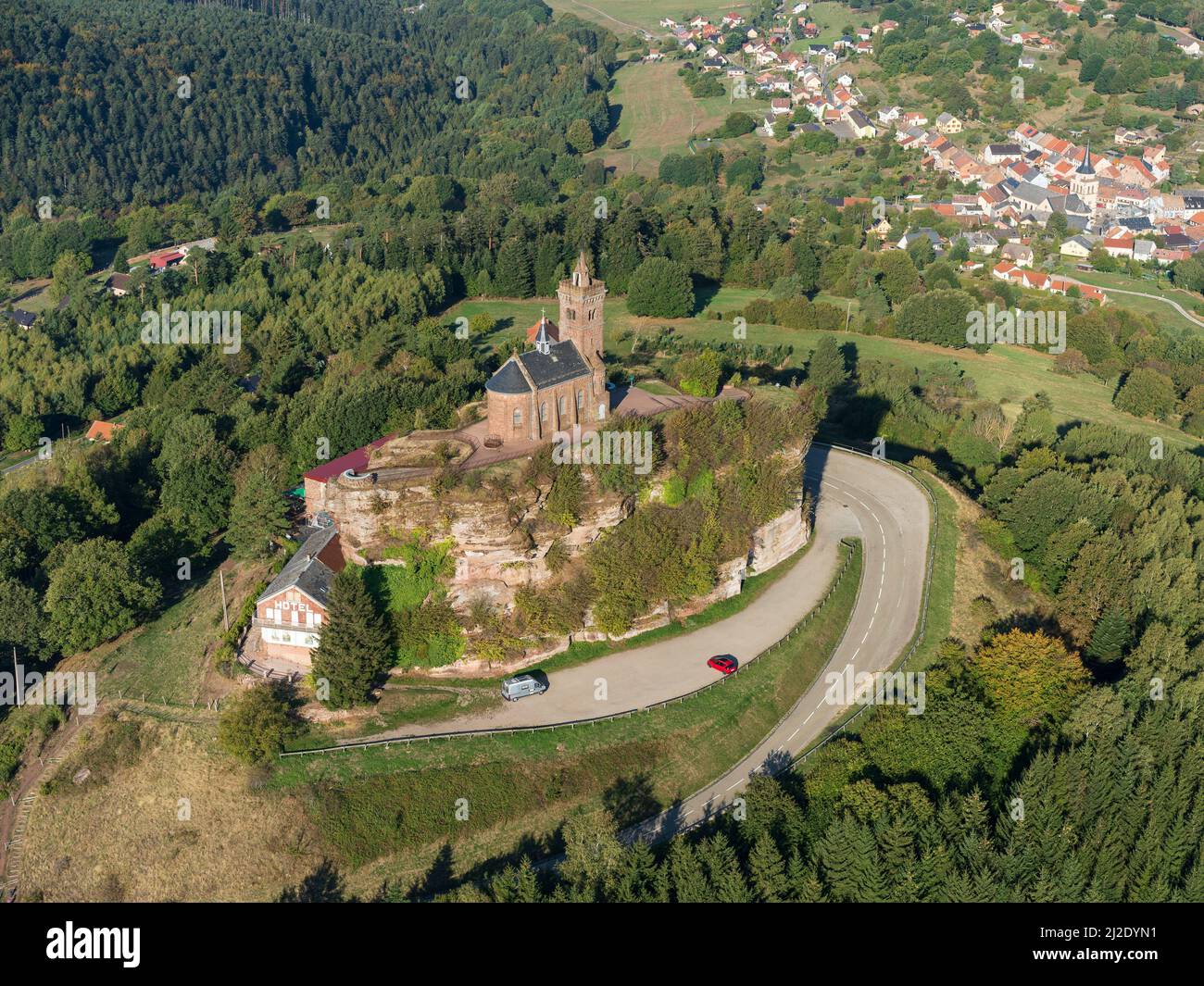 AERIAL VIEW. Saint-Léon Chapel perched on a sandstone butte overlooking ...