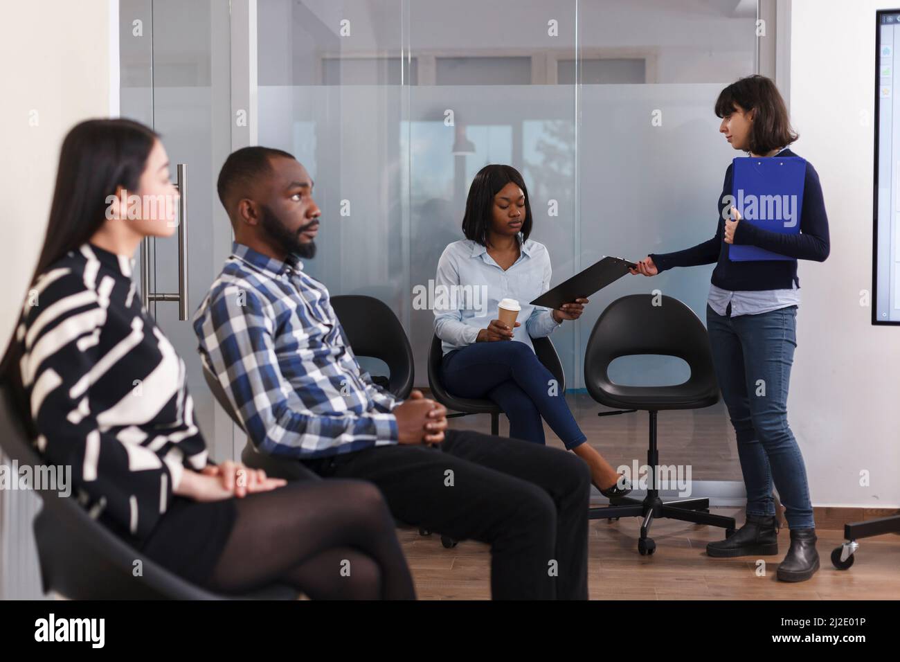 HR department manager giving to african american woman job application ...