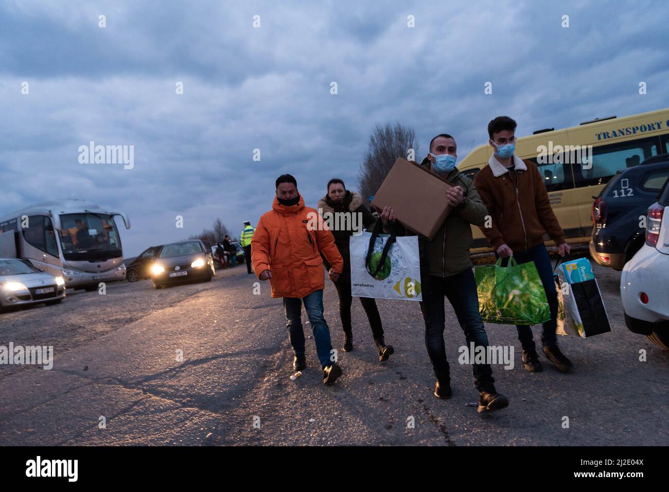 Volunteers carrying humanitarian aid material for the Ukrainian ...