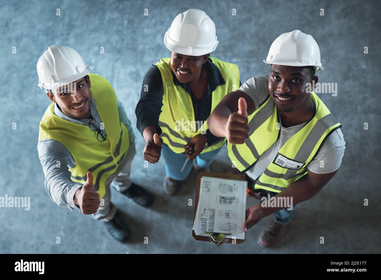 Youre good to go. High angle shot of a group of contractors standing in ...
