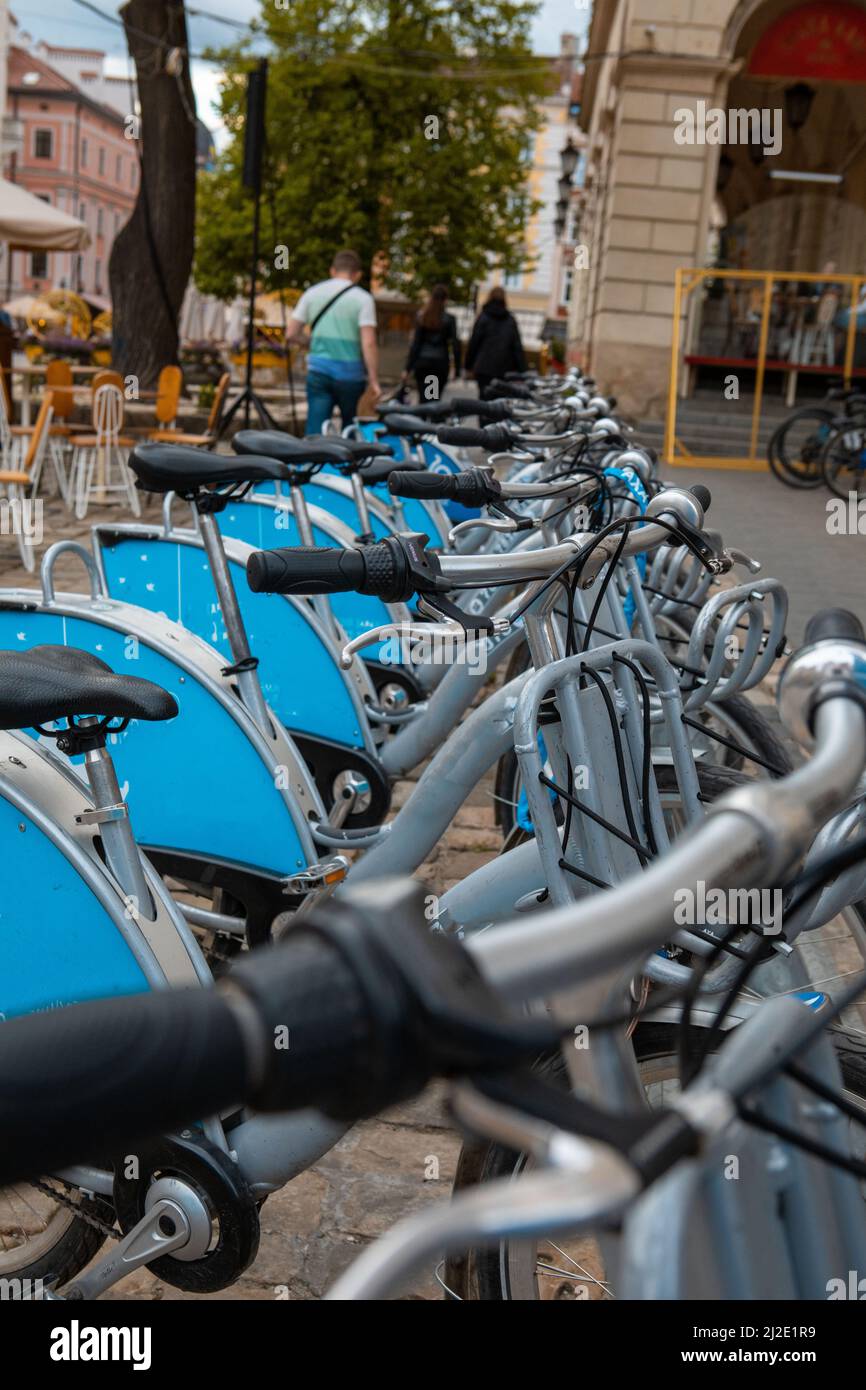 renting bike park at the city center modern transport Stock Photo - Alamy