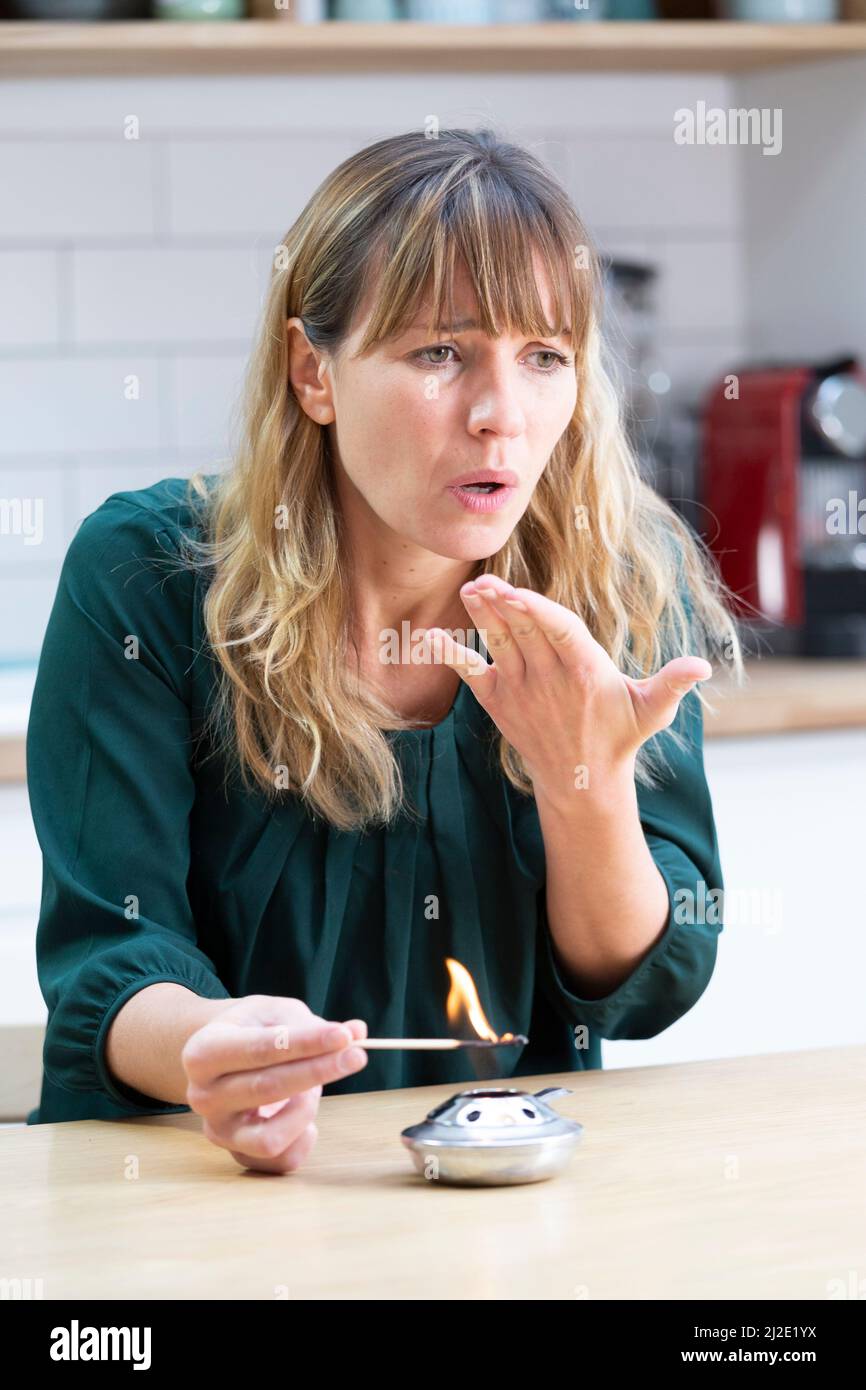 Woman fire pain hi-res stock photography and images - Alamy