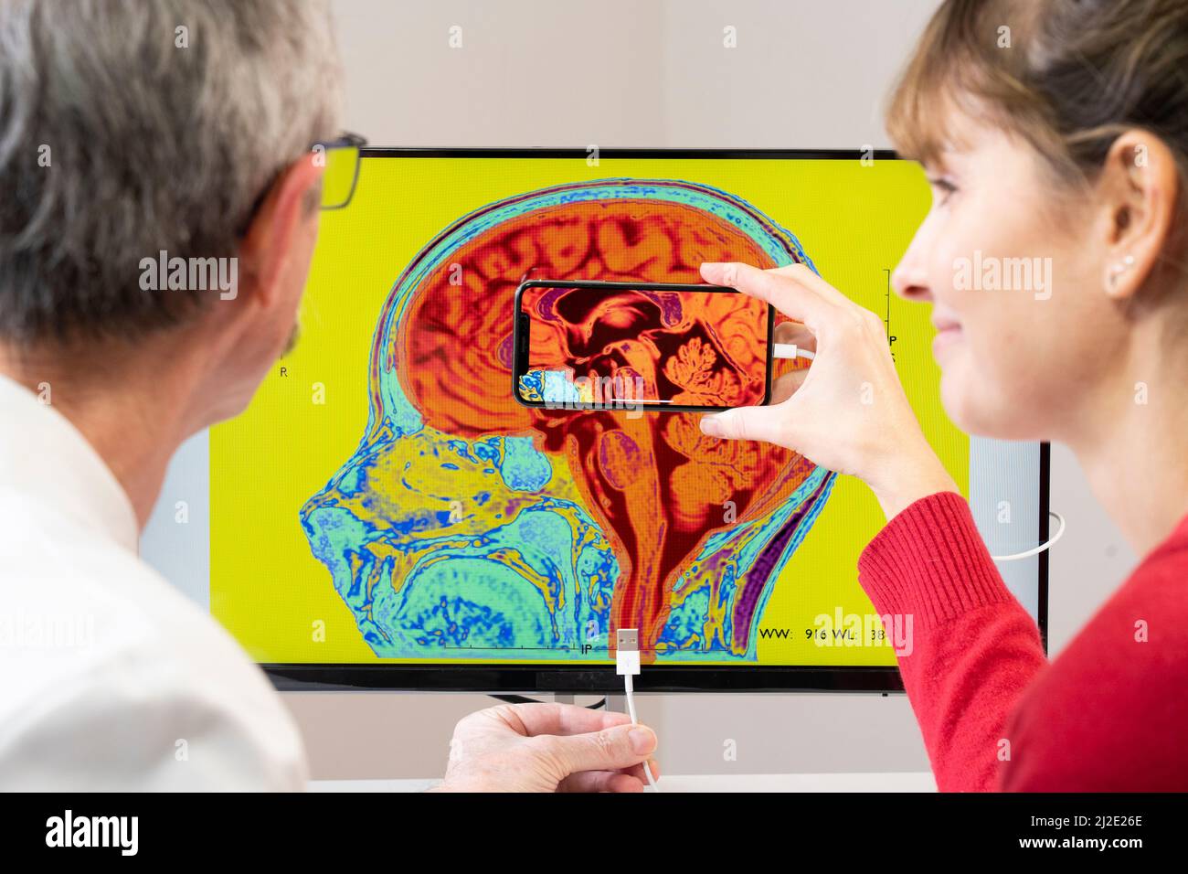Smartphone connected to the brain Stock Photo - Alamy