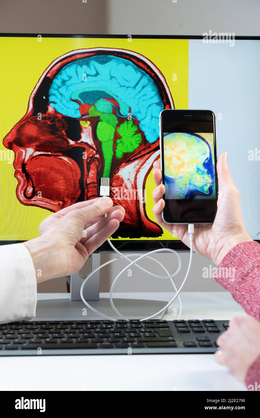 Brain connected to smartphone Stock Photo - Alamy