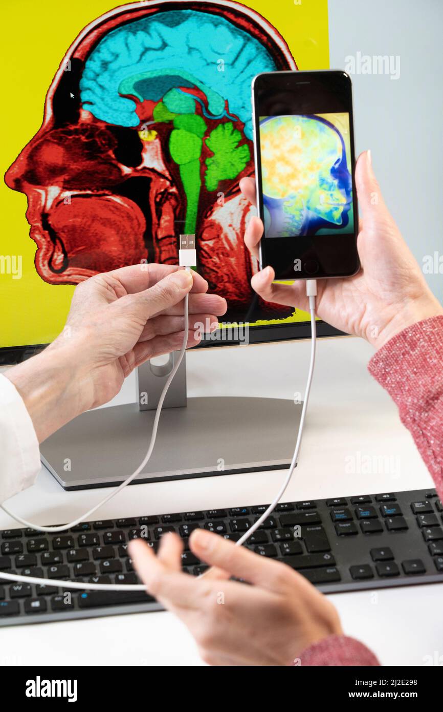 Brain connected to smartphone Stock Photo - Alamy