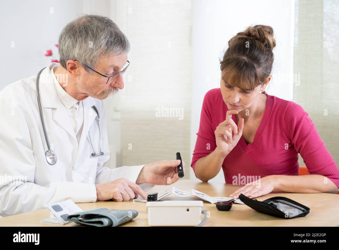 Diabetic woman with doctor Stock Photo - Alamy