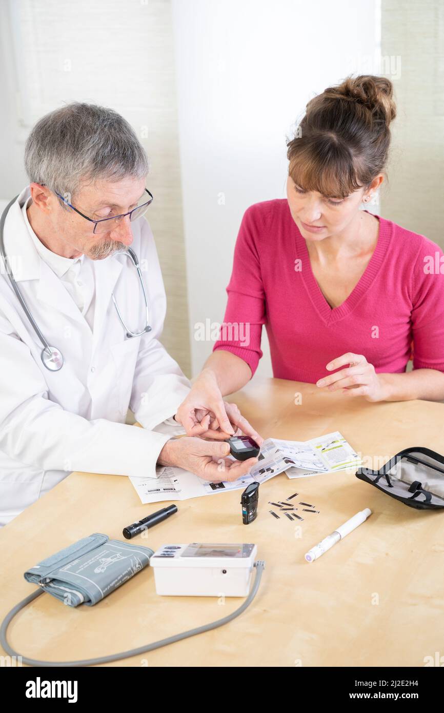 Diabetic woman with doctor Stock Photo - Alamy