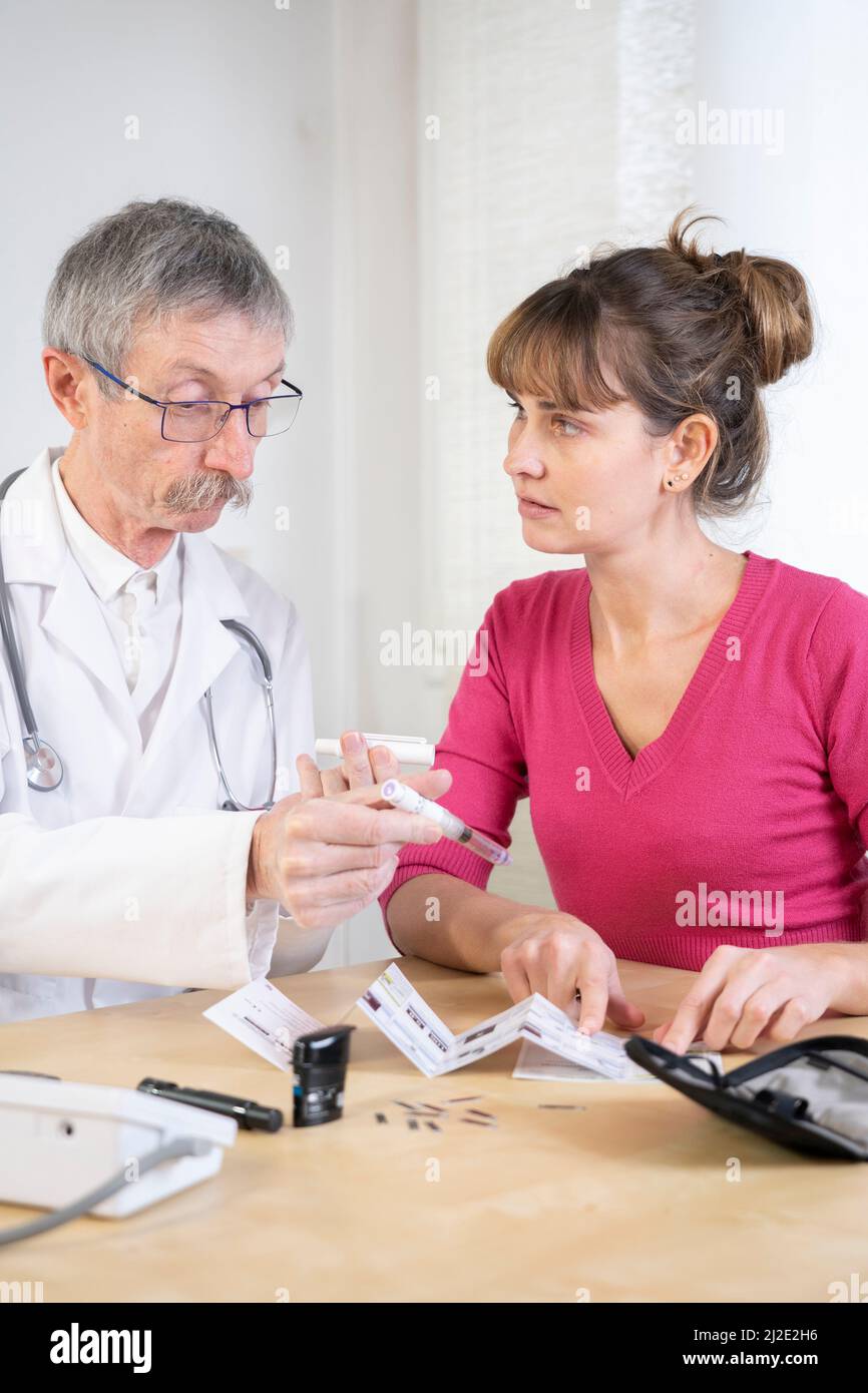 Diabetic woman with doctor Stock Photo - Alamy
