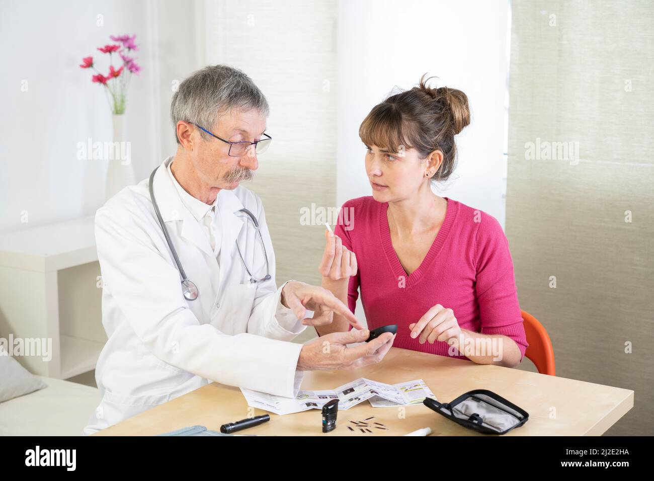Diabetic woman with doctor Stock Photo - Alamy