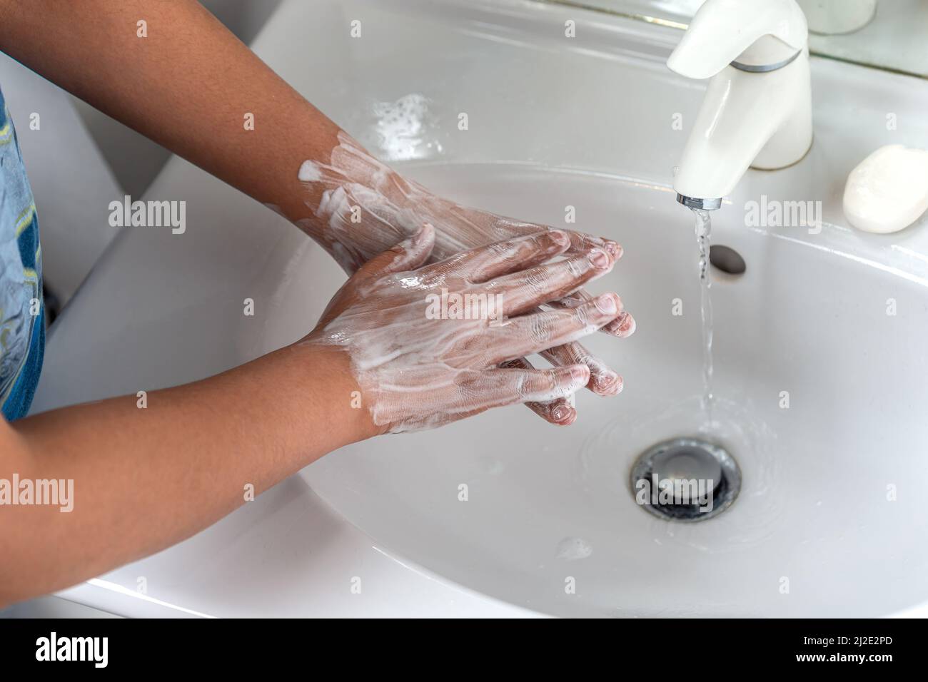 Woman washing hand soap hi-res stock photography and images - Alamy