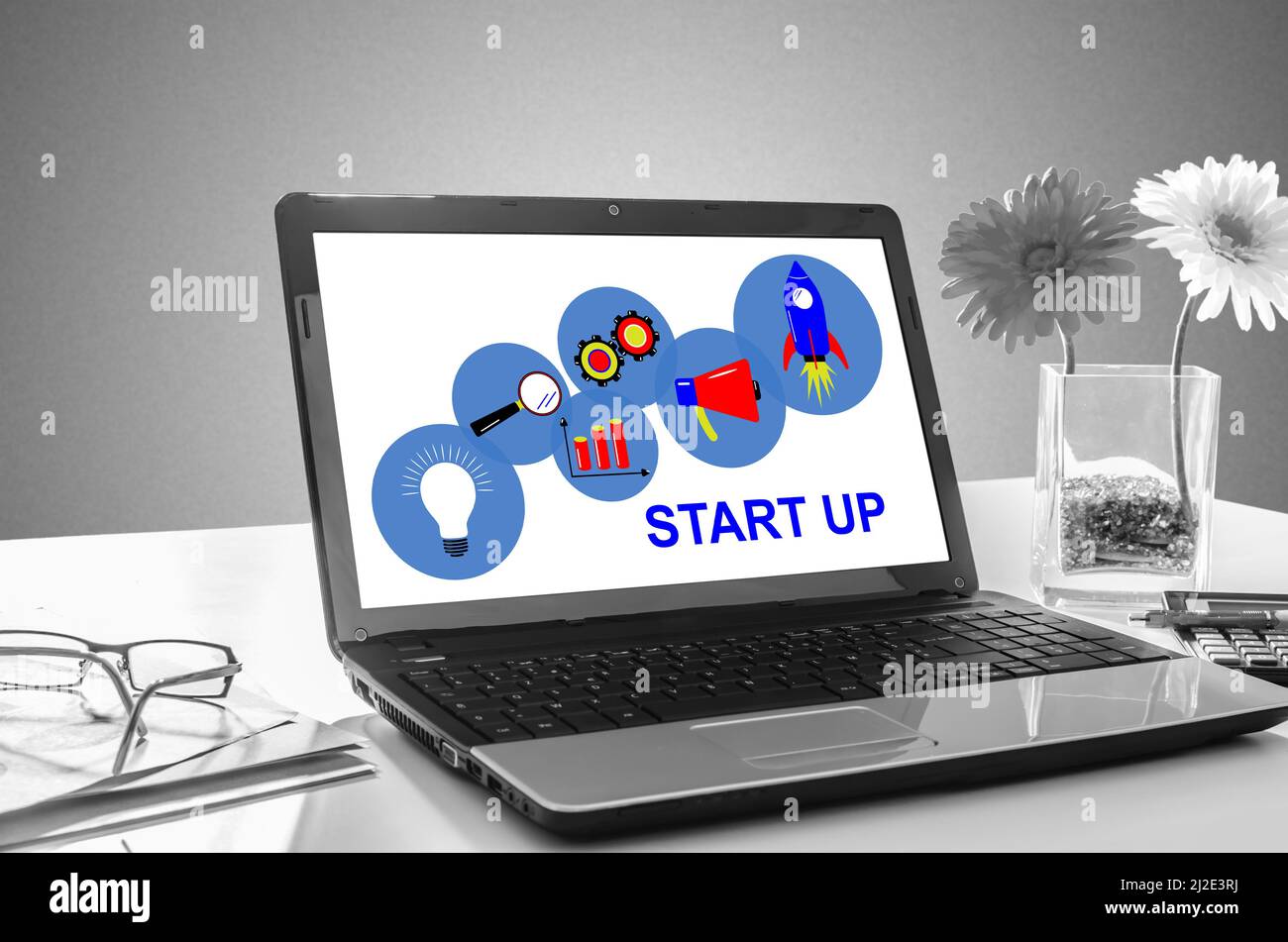 Laptop screen showing start up concept Stock Photo - Alamy