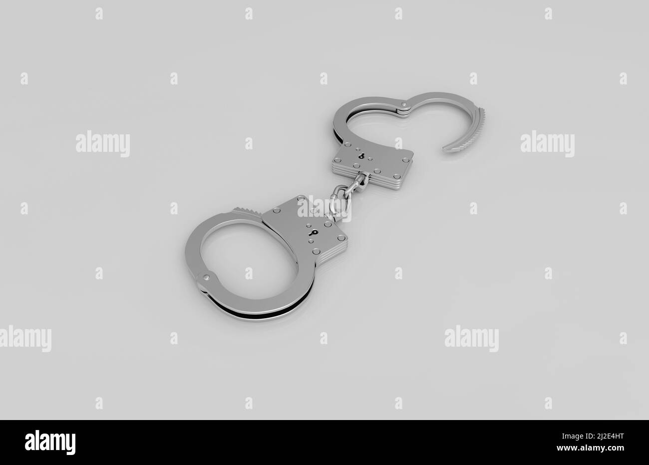 Metal handcuffs on light grey background Stock Photo - Alamy