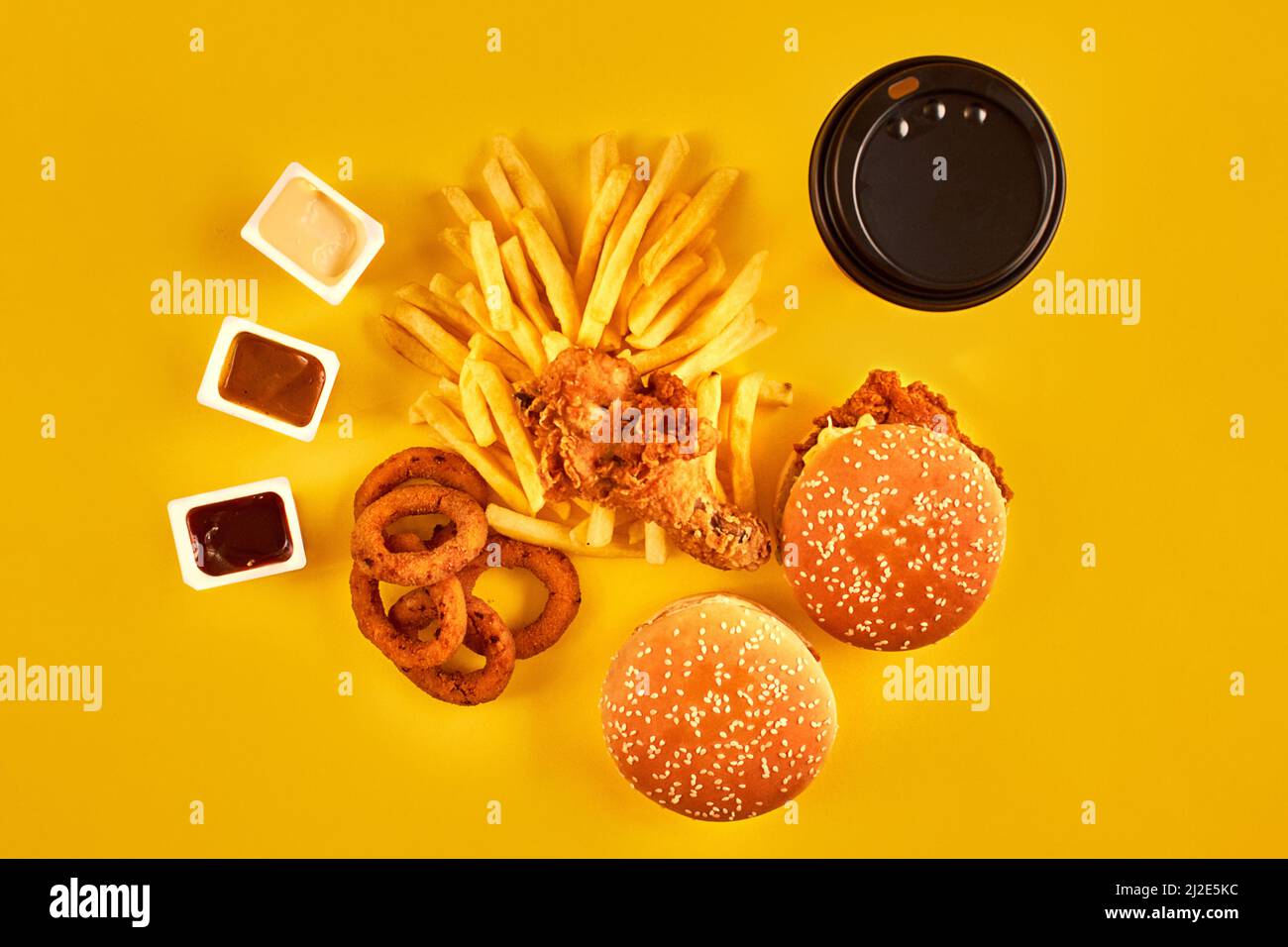 Fast food concept with greasy fried restaurant take out as onion rings ...