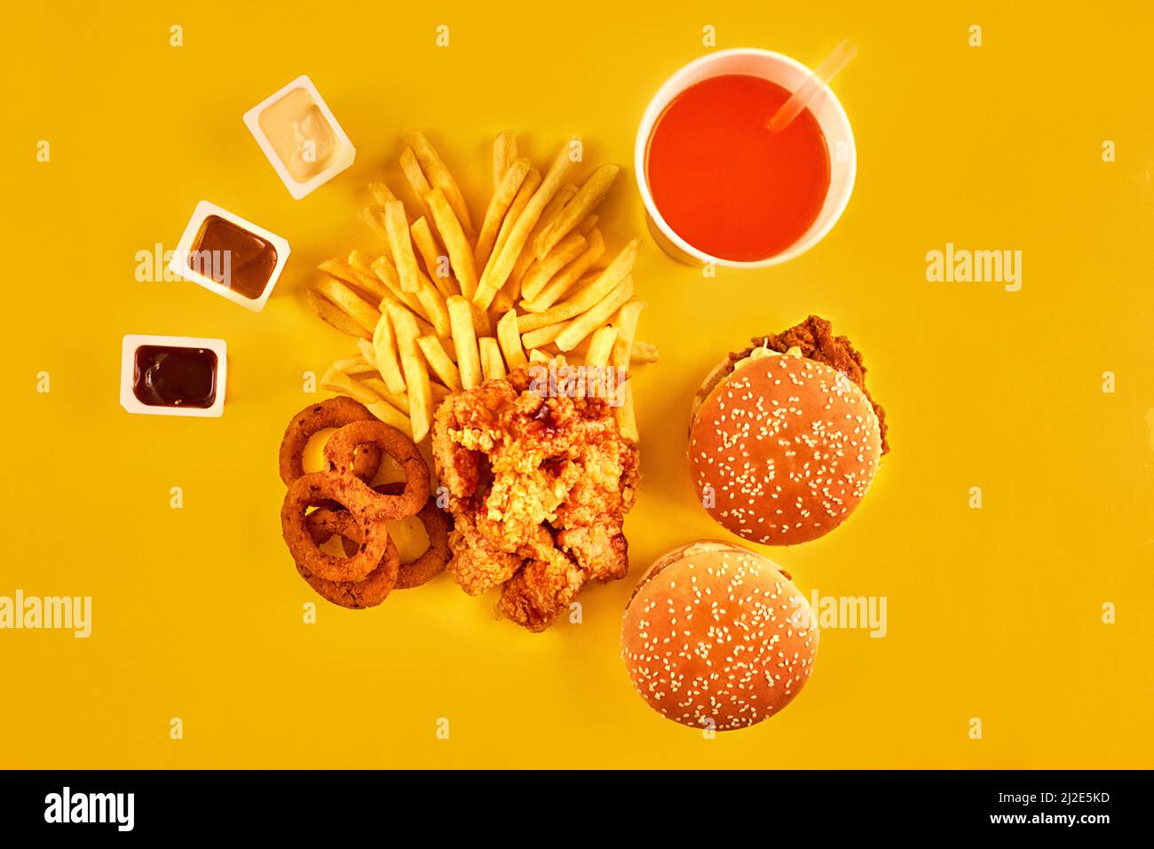 Fast food concept with greasy fried restaurant take out as onion rings ...