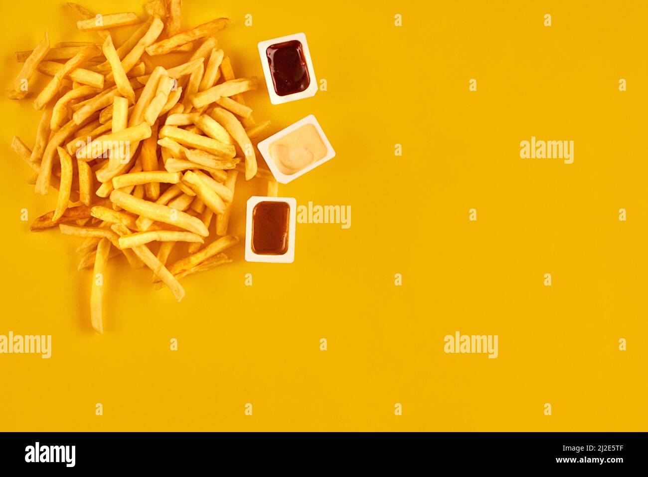 Fast food concept with greasy fried restaurant take out as onion rings ...