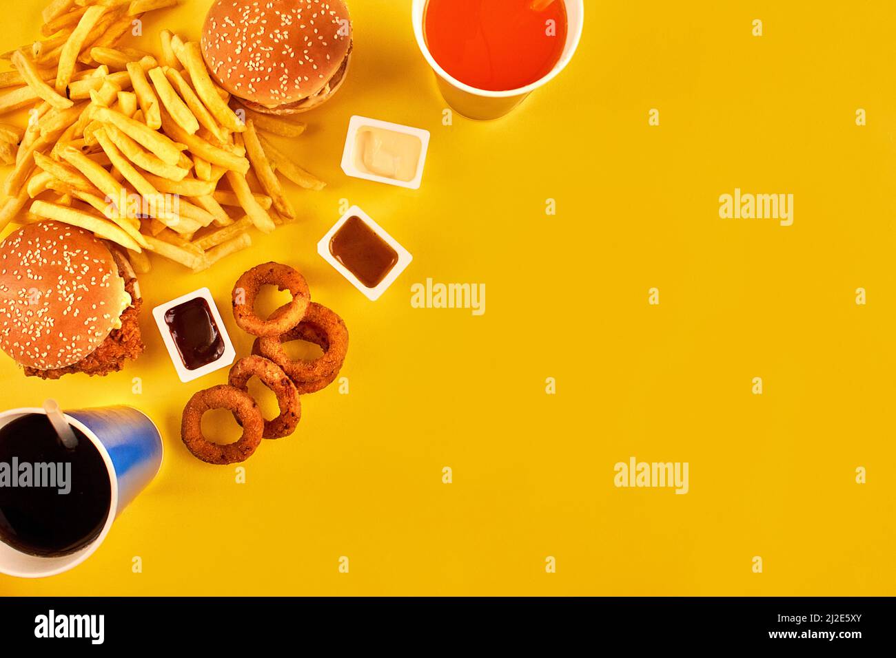 Fast food concept with greasy fried restaurant take out as onion rings ...
