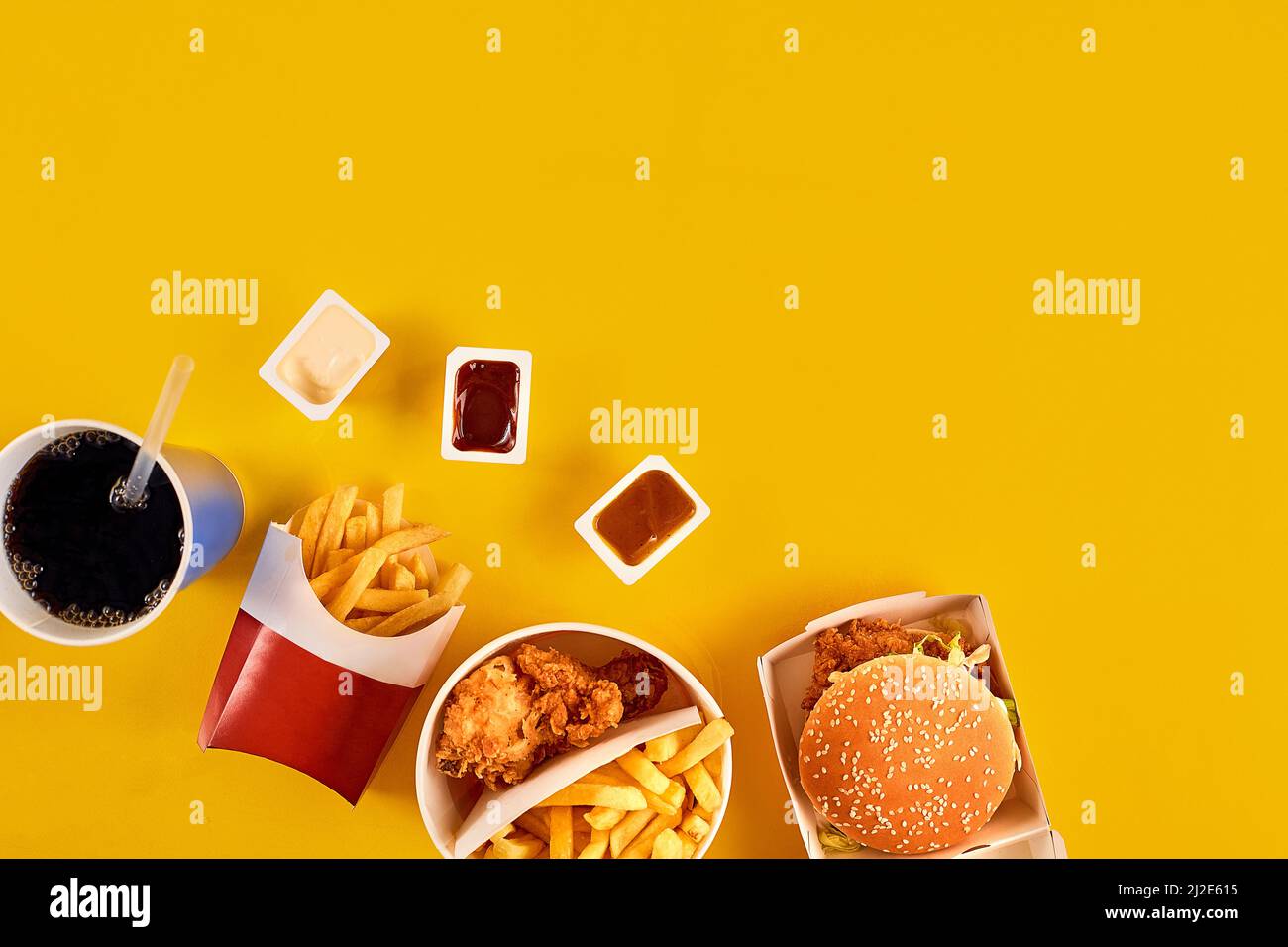 Fast food concept with greasy fried restaurant take out as onion rings ...