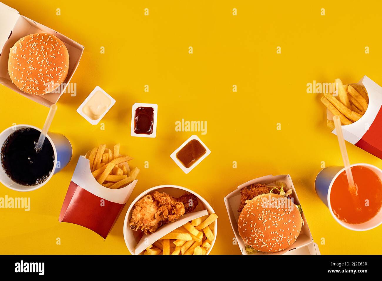 Fast food concept with greasy fried restaurant take out as onion rings ...