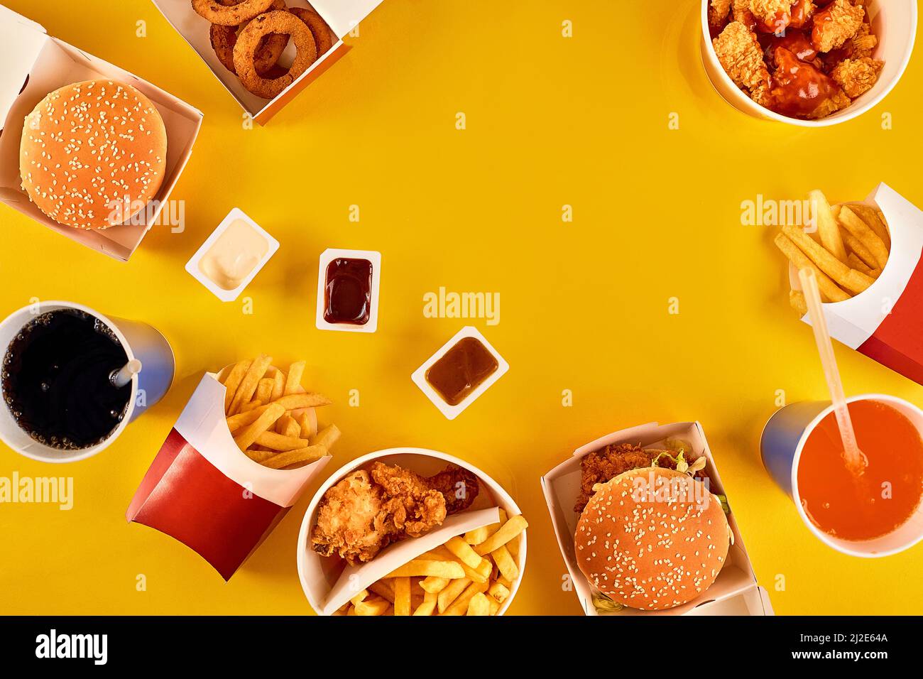 Fast food dish top view. Meat burger, potato chips and wedges. Take ...