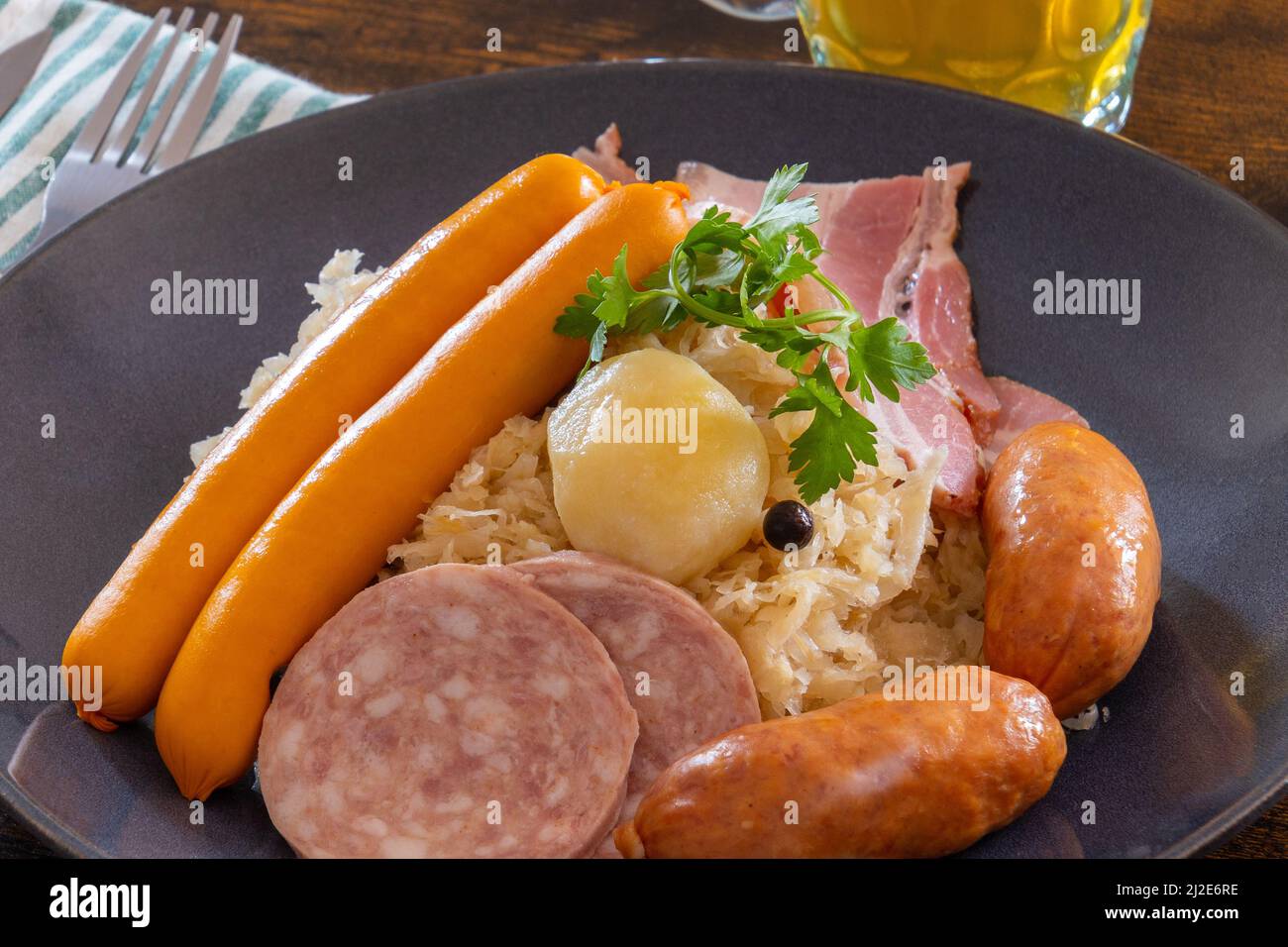Choucroute garnie (French for dressed sauerkraut) is an Alsatian recipe ...