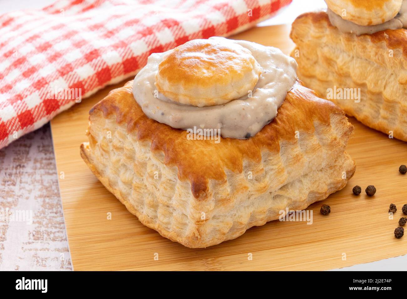 puff pastry garnished with veal rice on wooden board Stock Photo - Alamy